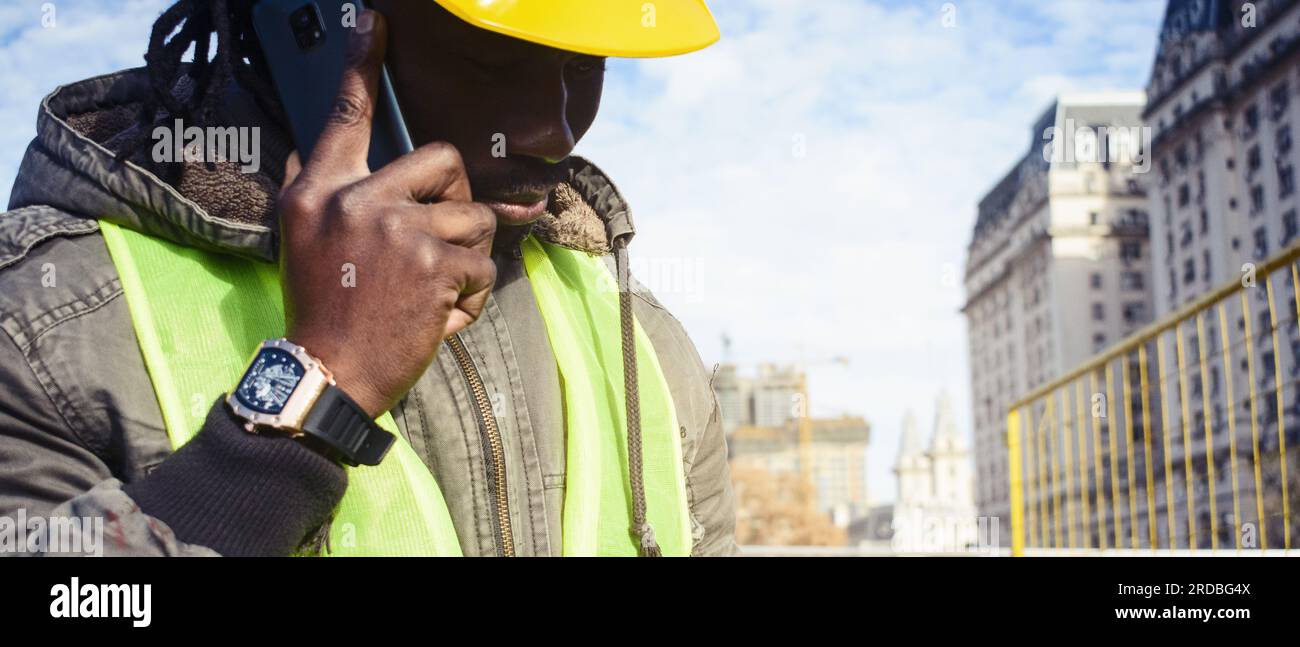 closeup banner of black male civil engineer wearing yellow safety ...