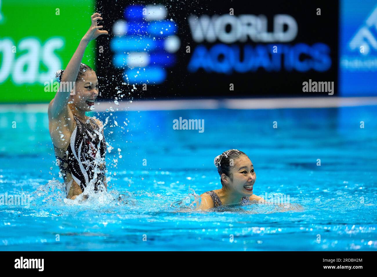 Mashiro Yasunaga and Moe Higa, of Japan, compete in the duet free final ...