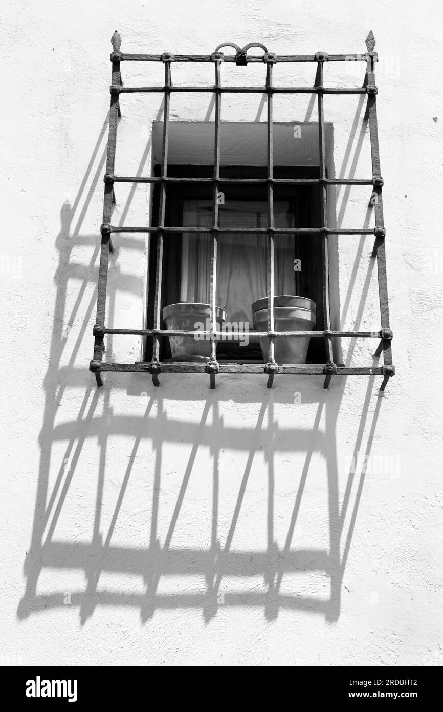 Forged iron grill on window with clay pots in Altea town, Spain ...