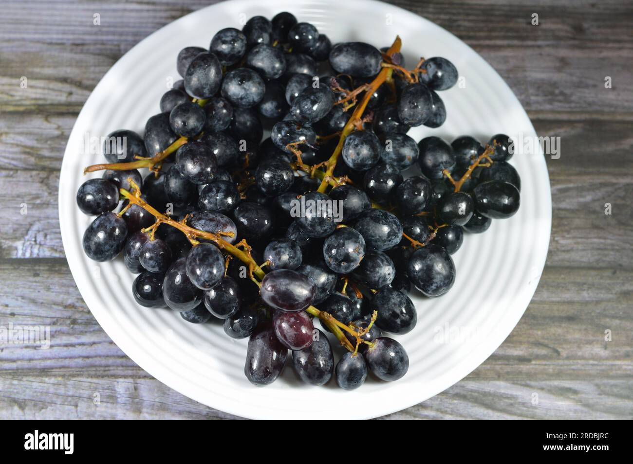 Black grapes, a fruit, botanically a berry of the deciduous woody vines ...