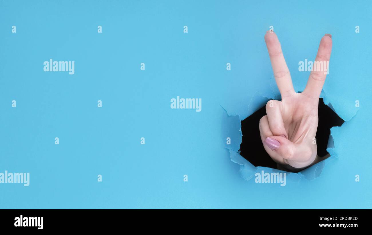 Peace gesture. Victory sign. Female hand showing number two with ...