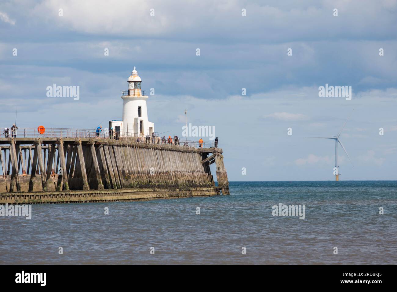 Blyth Pier Lighthouse and offshore wind turbine, Northumberland Stock ...