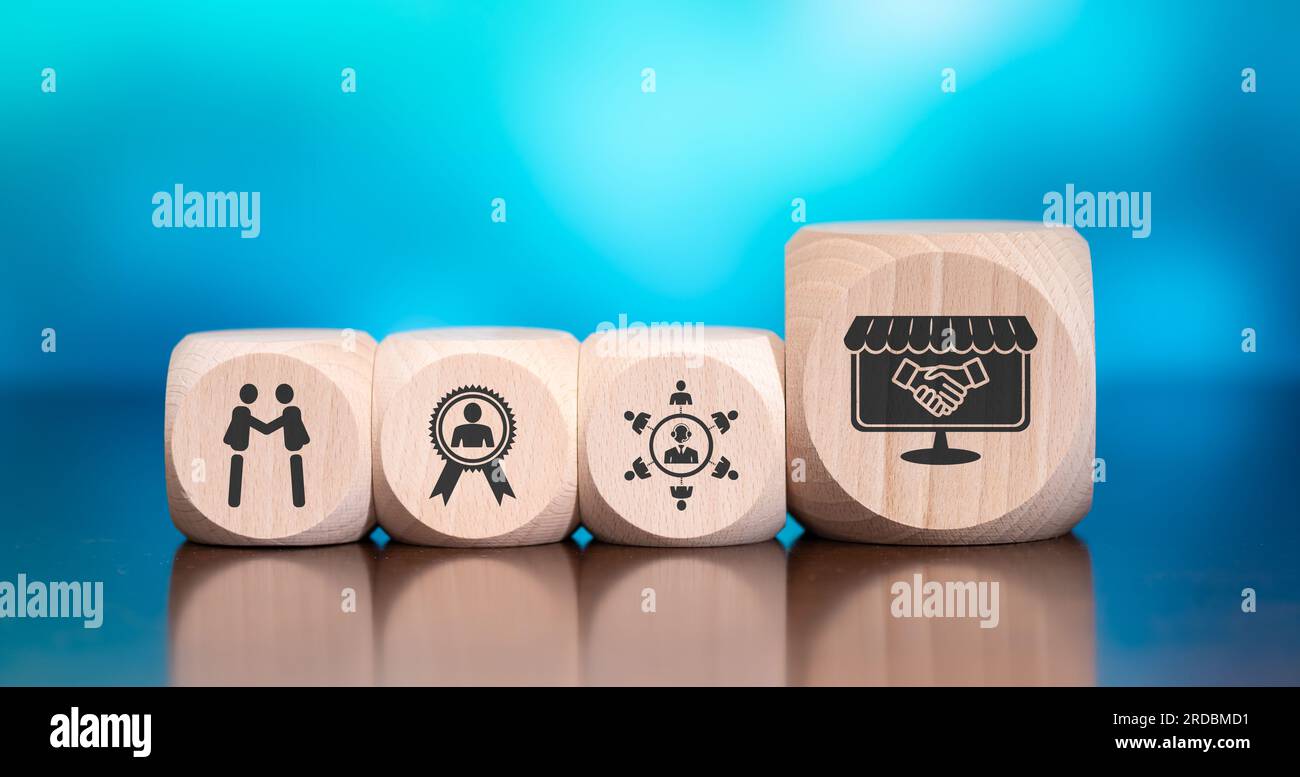 Wooden blocks with symbol of customer loyalty concept on blue ...