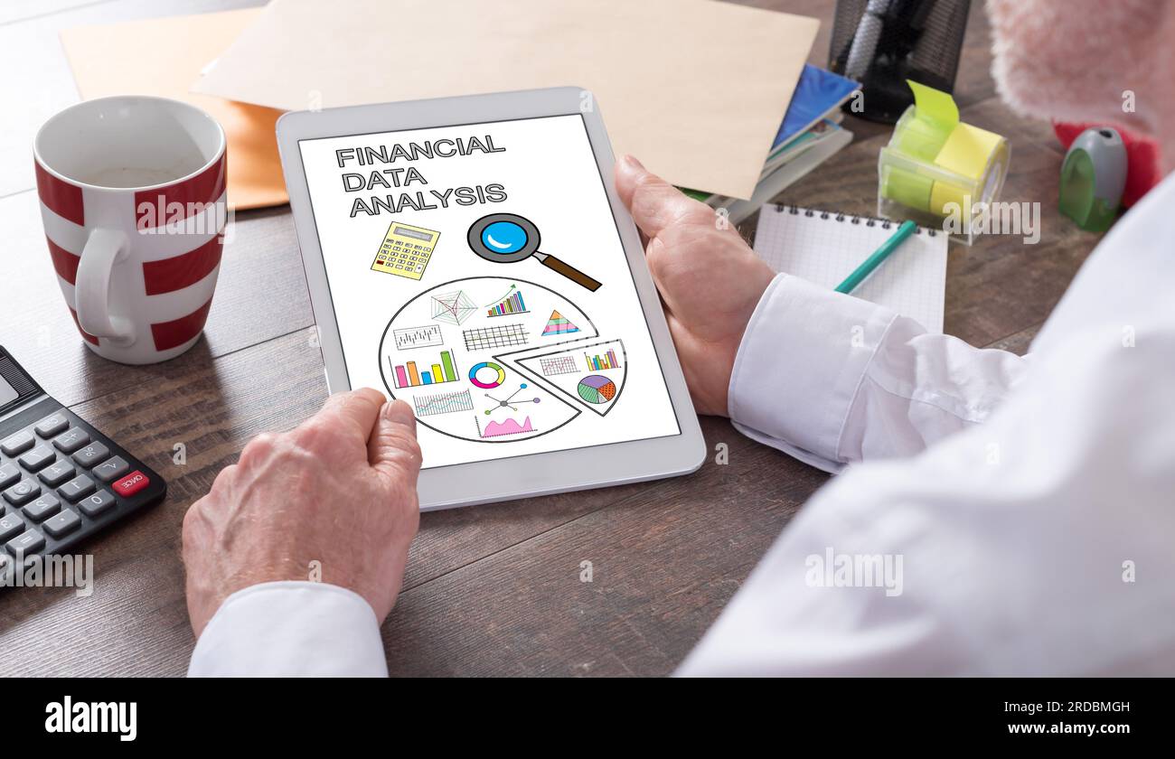 Financial data analysis concept shown on a tablet held by a man Stock ...