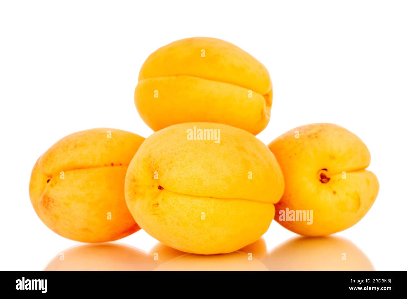 Four ripe sweet apricots, macro, isolated on white background Stock ...