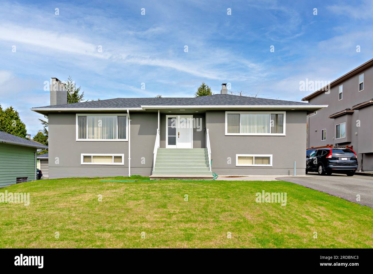 Average residential house with landscaped front yard in Canada Stock ...