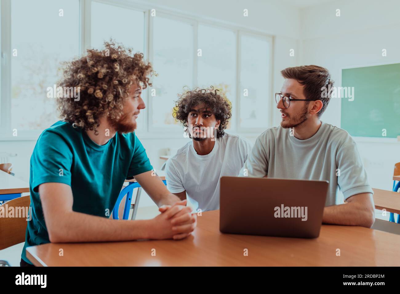 Group students including one African-American, sit together in a ...