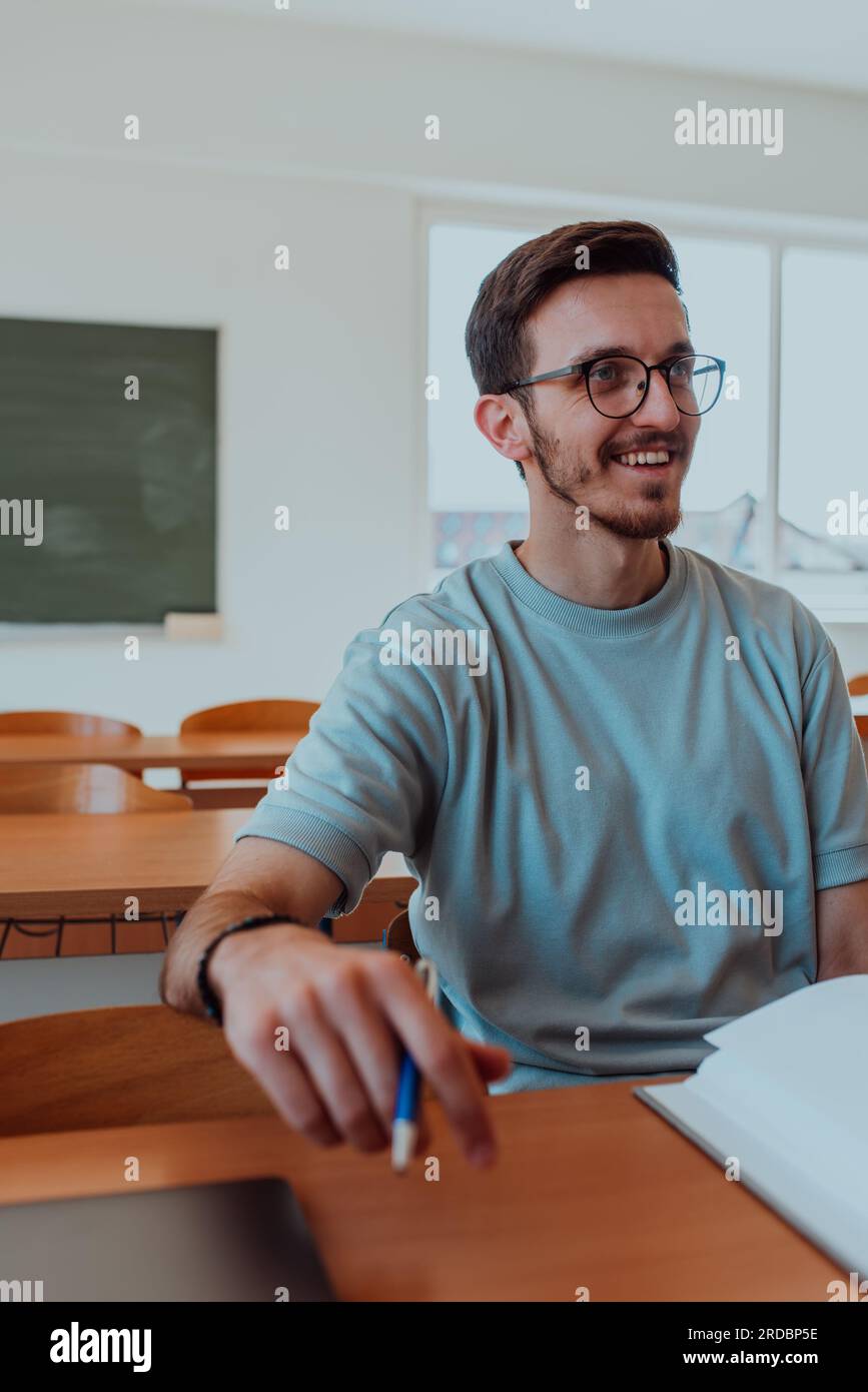 The student carefully follows the lessons in a modern classroom Stock ...