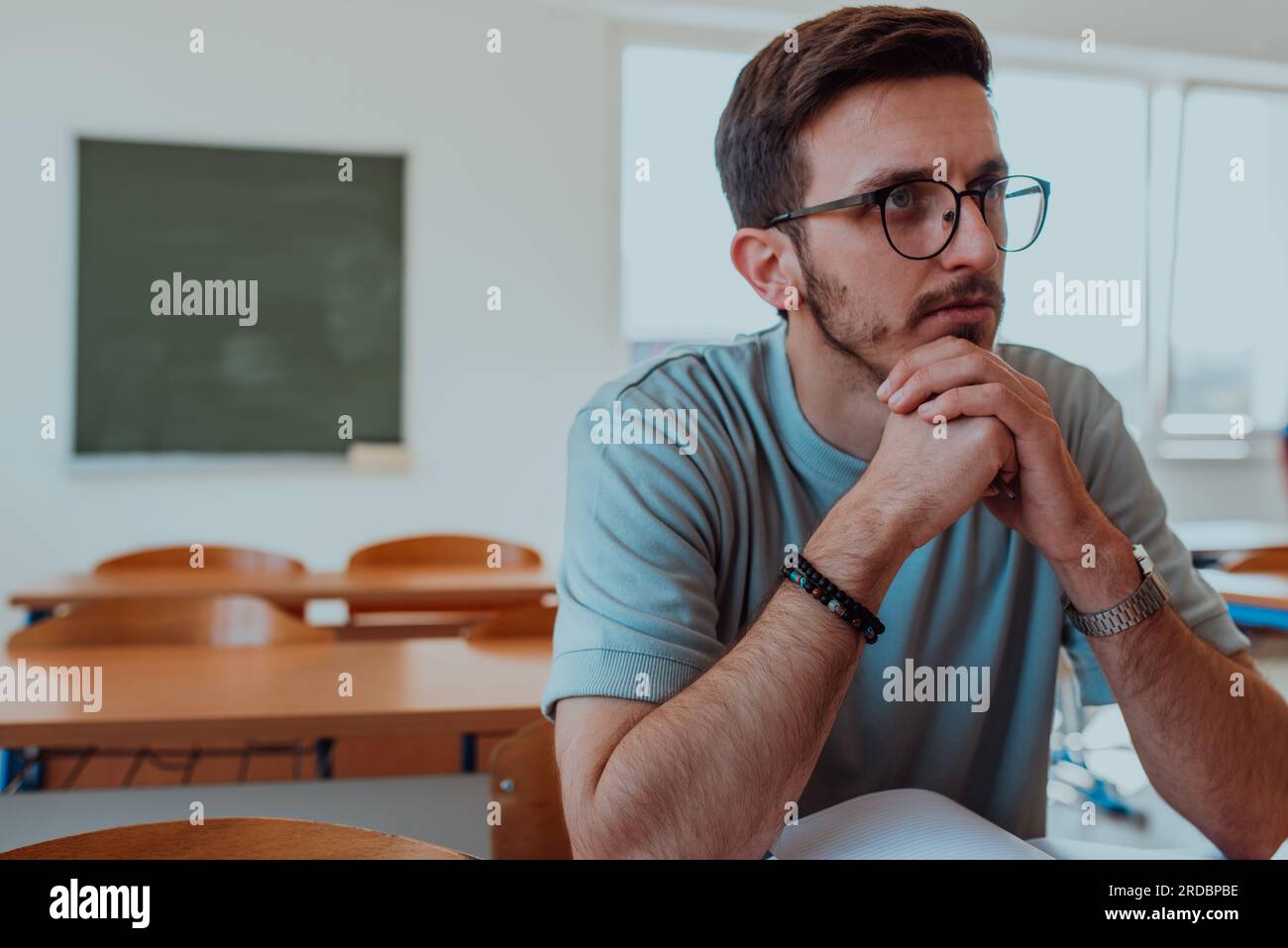 The student carefully follows the lessons in a modern classroom Stock ...