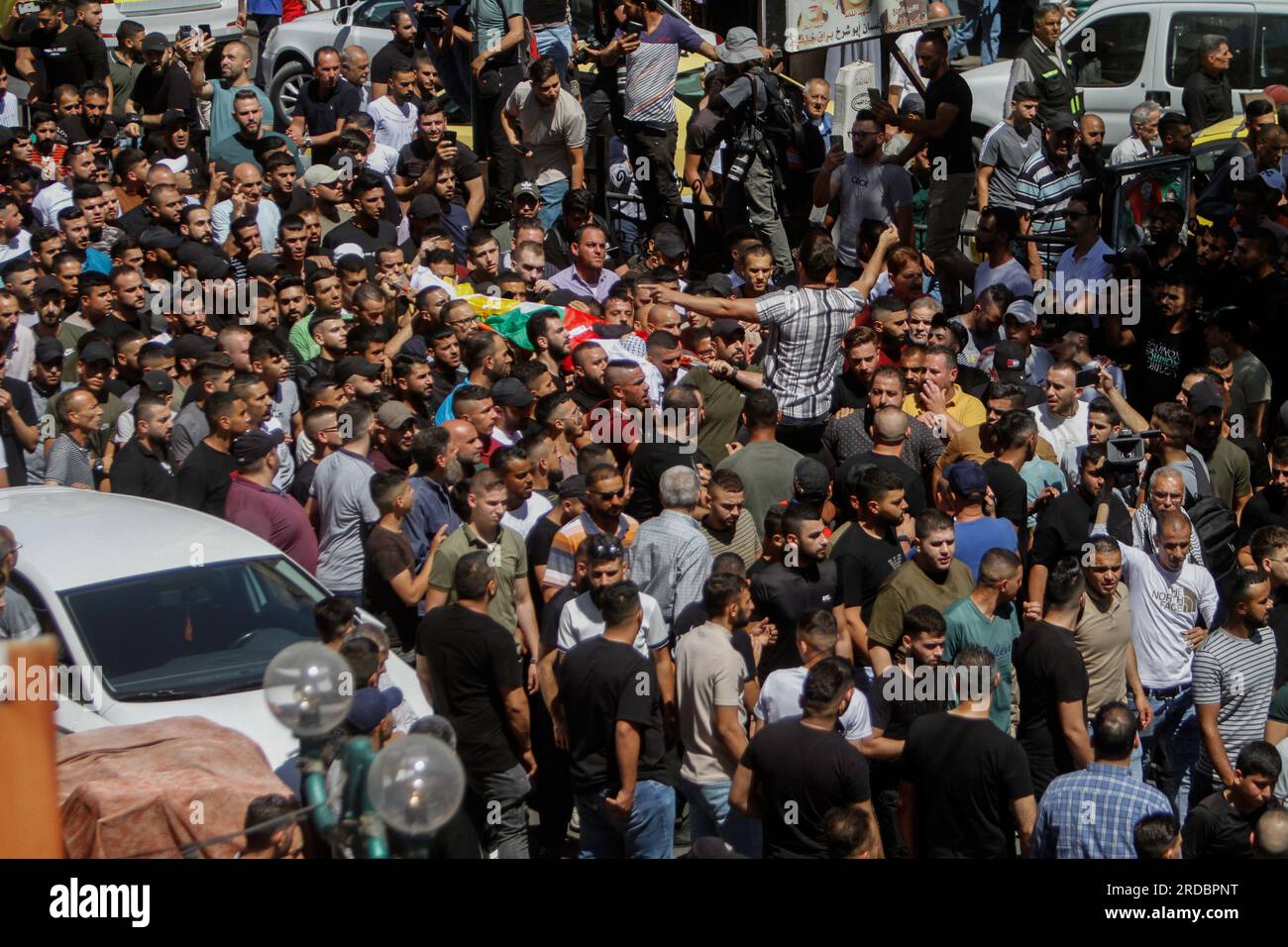(EDITOR'S NOTE: Image depicts death) Mourners carry the body of ...