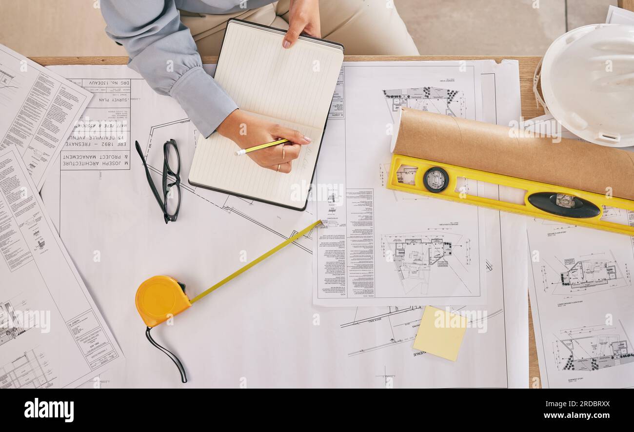 Above, blueprint and hands with notes for architecture, construction ...