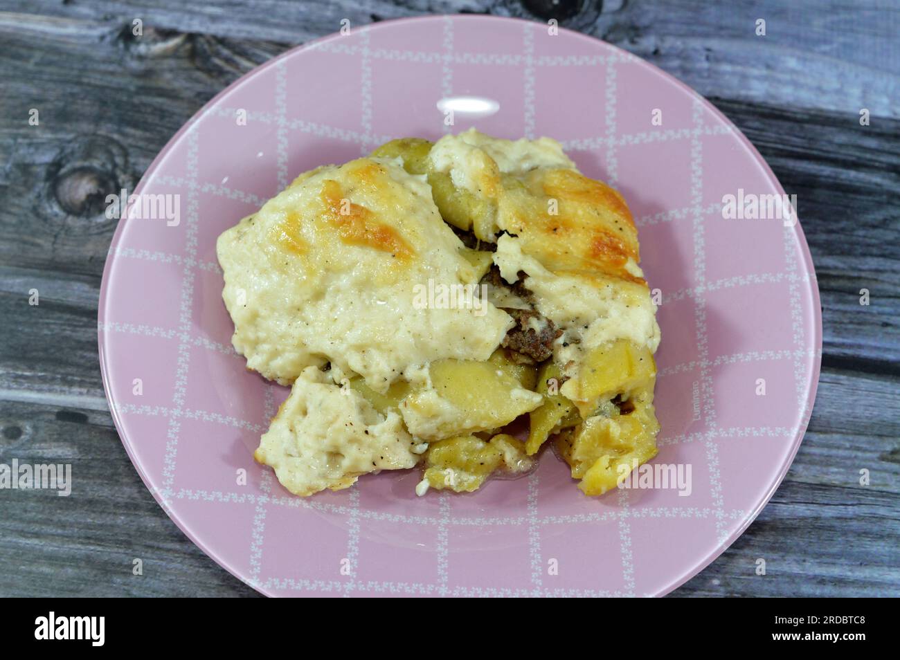 Baked zucchini courgette bechamel sauce and ground minced meat and ghee ...
