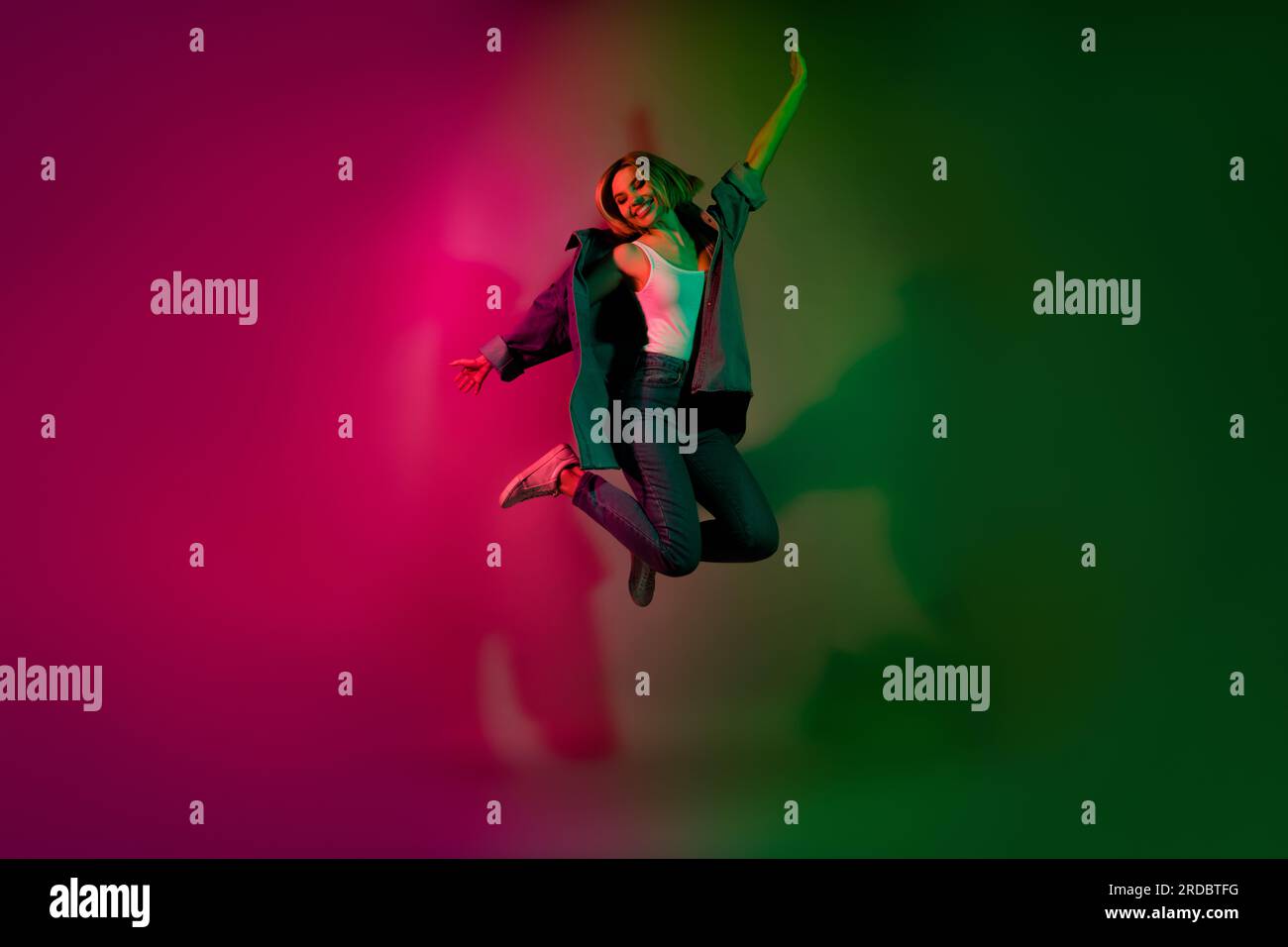 Full length photo of cheerful girl feel playful jumping dance move in ...