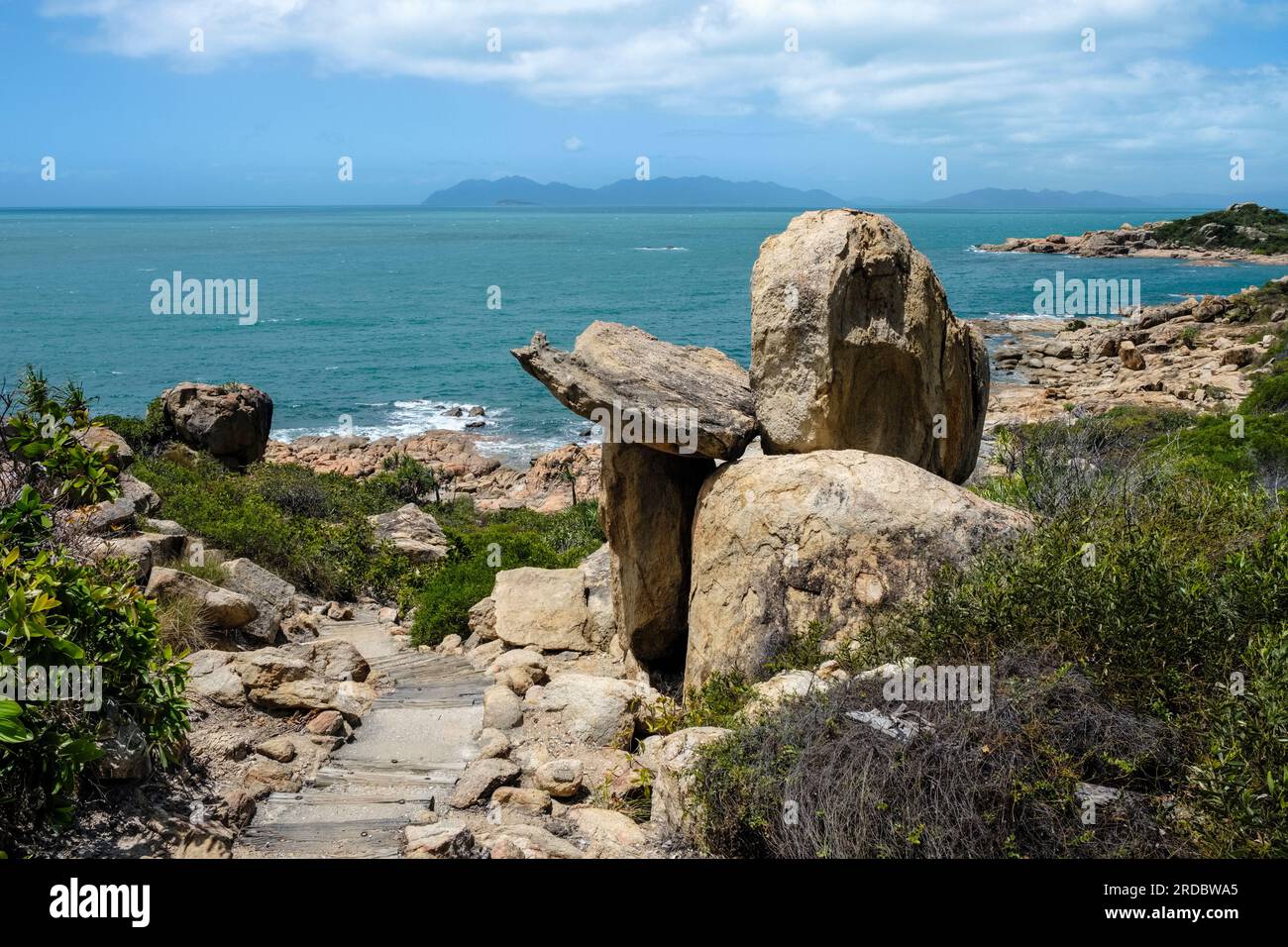 Steps and footpath leading down to Horseshoe Bay with a view towards ...