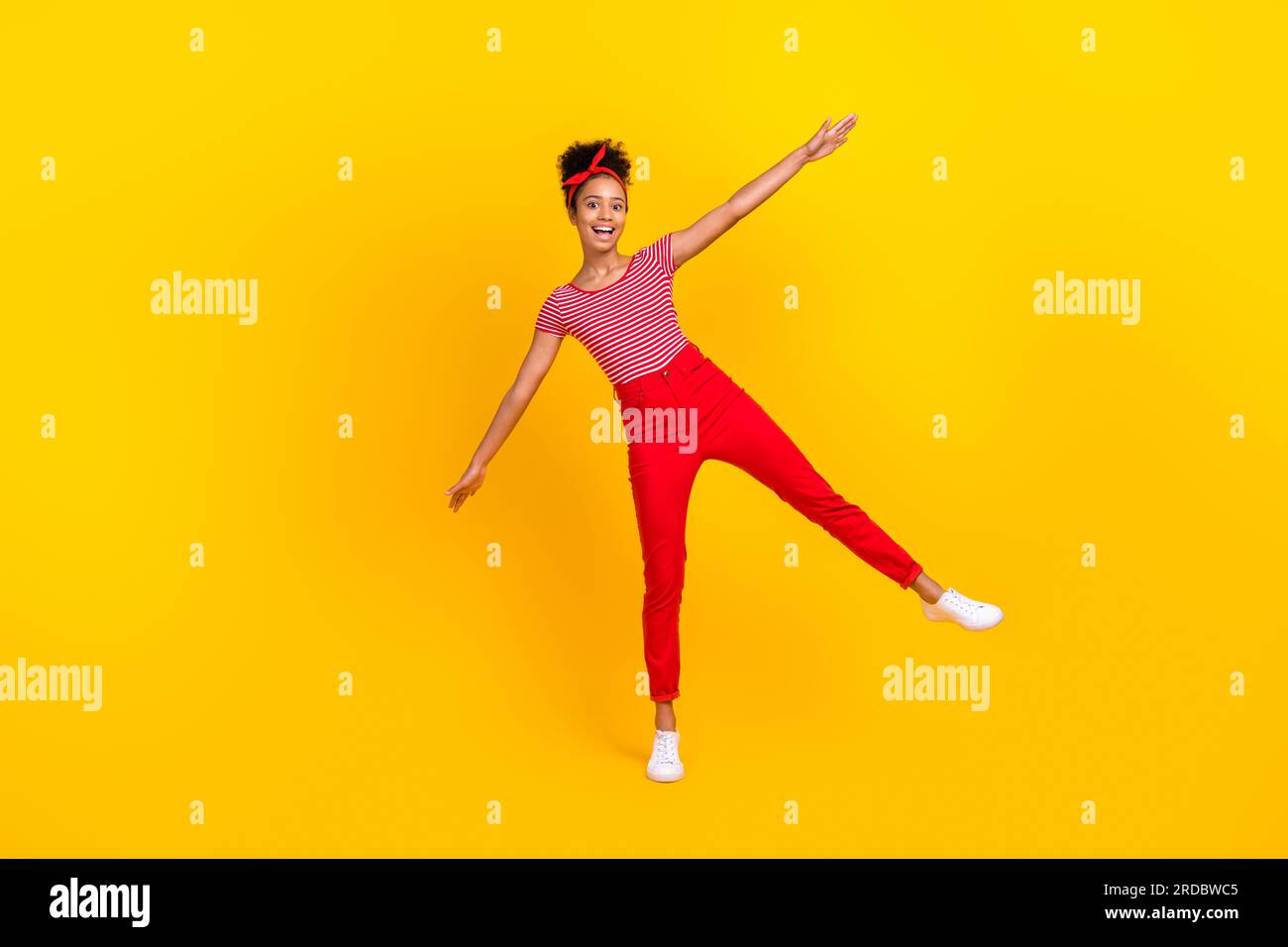 Full Length Photo Of Cute Teen Girl Spread Hands Plane Wings Fooling Wear Trendy Red Striped