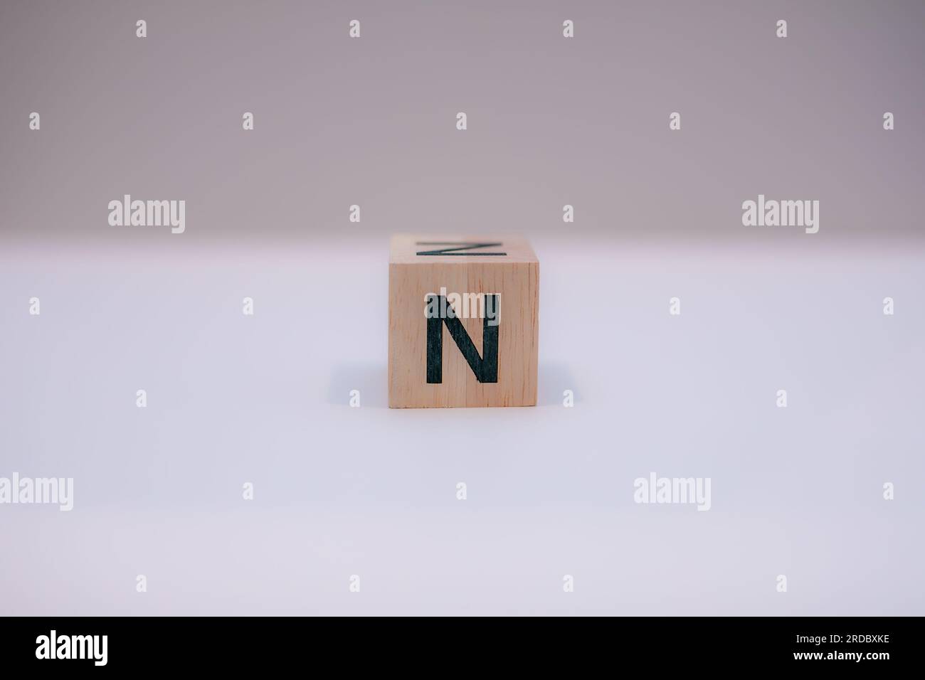 Wooden block written "N" with a white background Stock Photo - Alamy