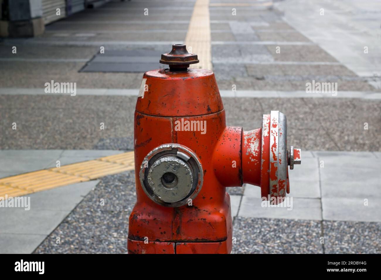 Emergency metal fire hydrant on the sidewalk in the city Stock Photo ...