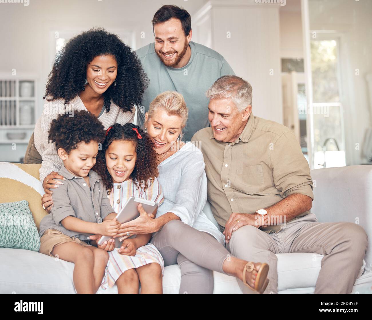 Big family, tablet and children in home, happy and bonding together in ...