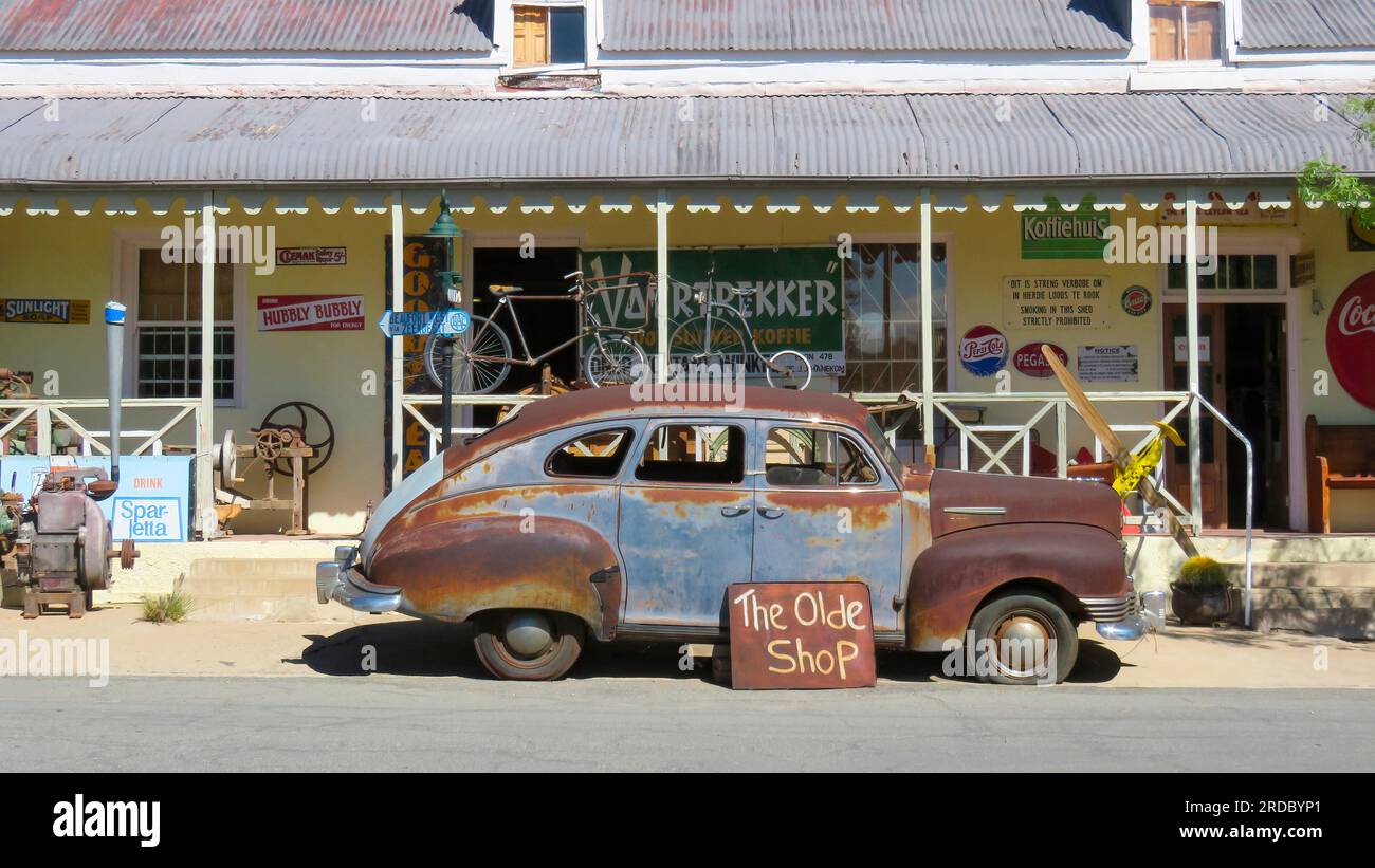Rusting relic outside antques shop Stock Photo - Alamy