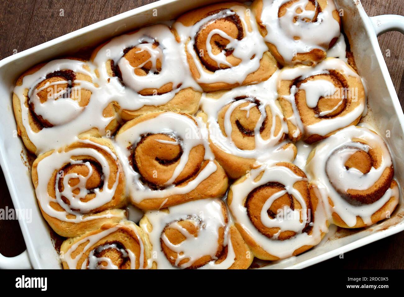 Cinnamon rolls in an oblong white baking dish viewed from above Stock ...