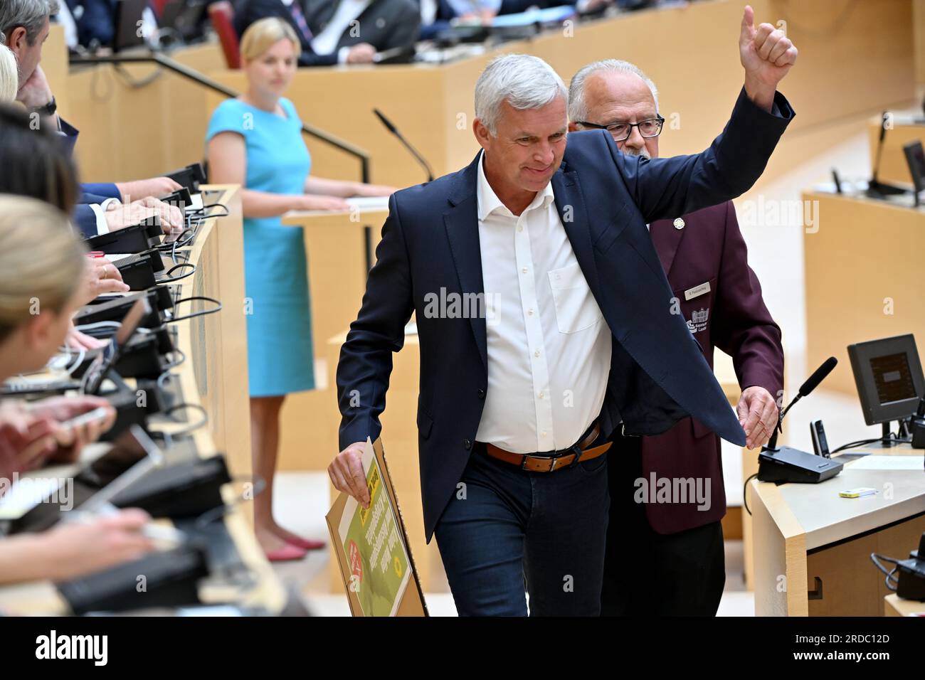 20 July 2023, Bavaria, Munich: Ralf Stadler of the AfD is escorted to ...