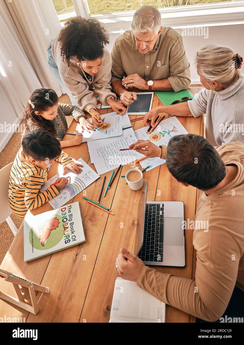 Family home, kids and homework with learning, grandparents and parents ...