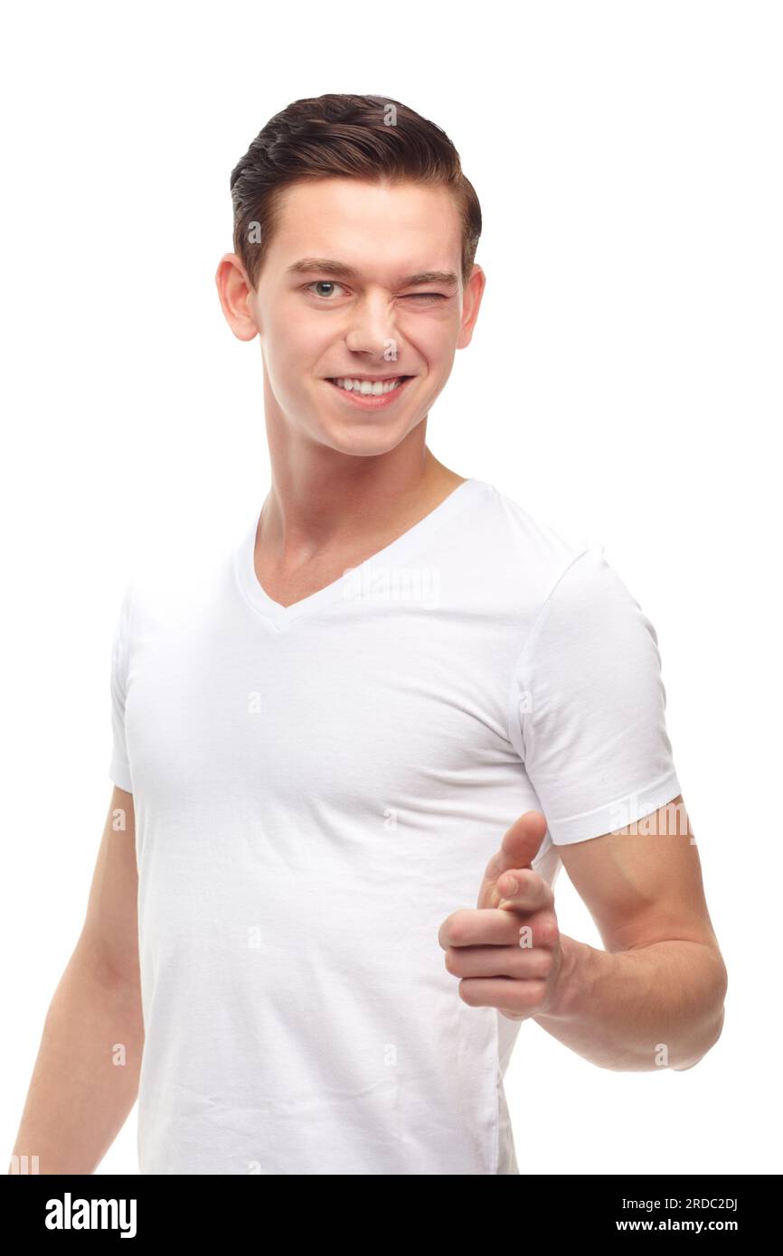 Casually handsome. A cropped portrait of a confident young man pointing ...