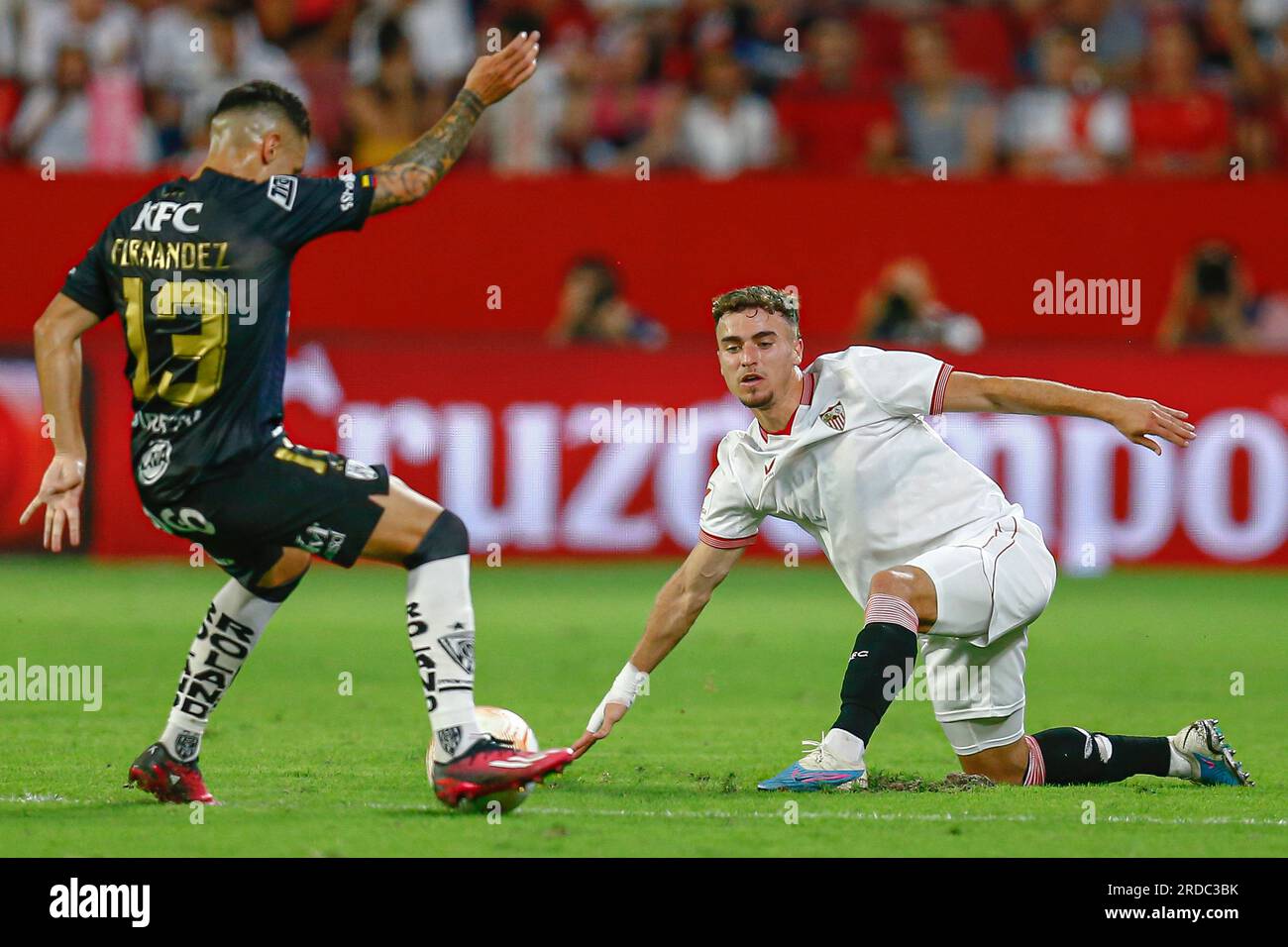Adria Pedrosa of Sevilla FC and Matias Fernandez of Independiente del ...