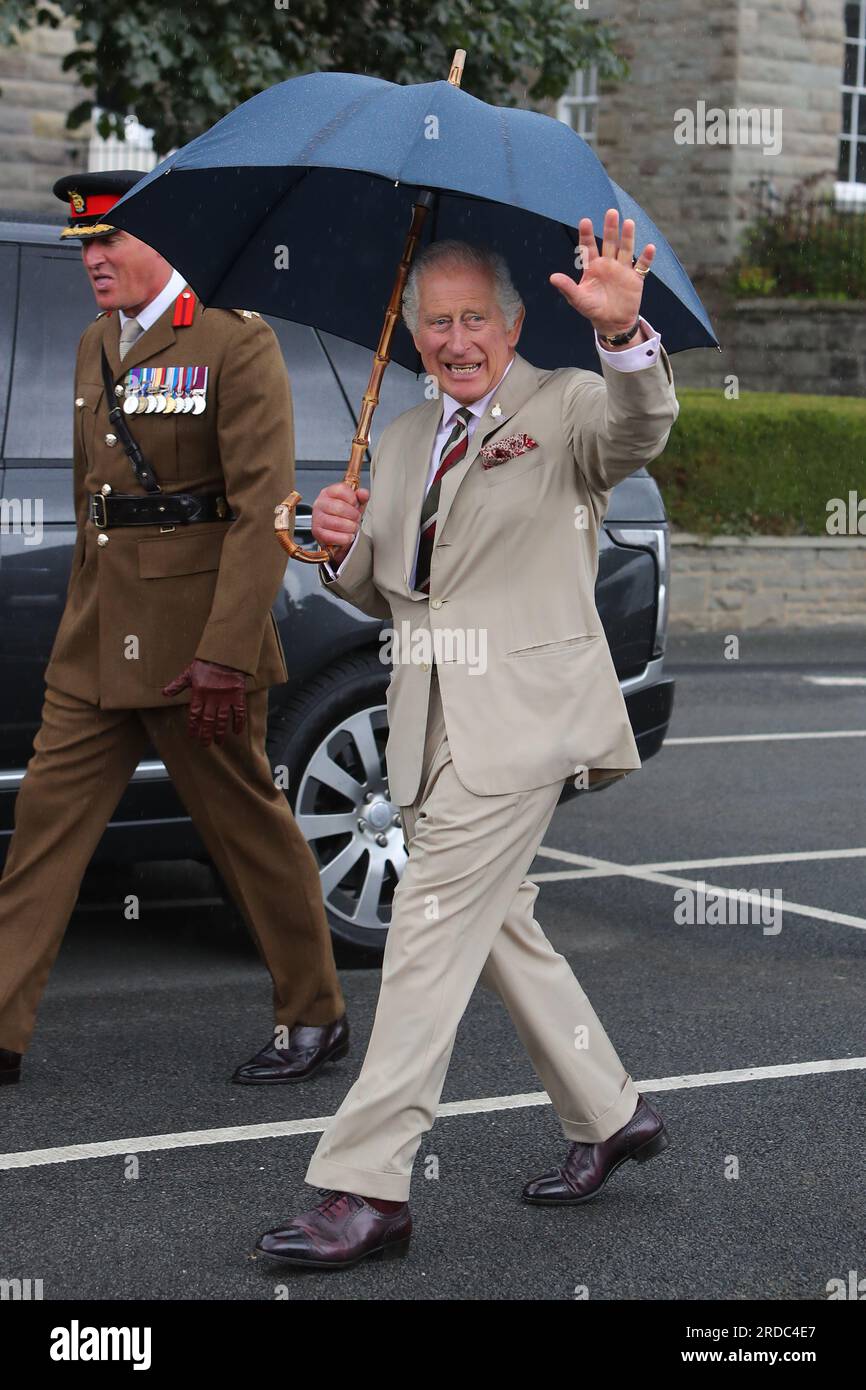 King Charles III waves during a visit to Brecon Barracks in Brecon ...