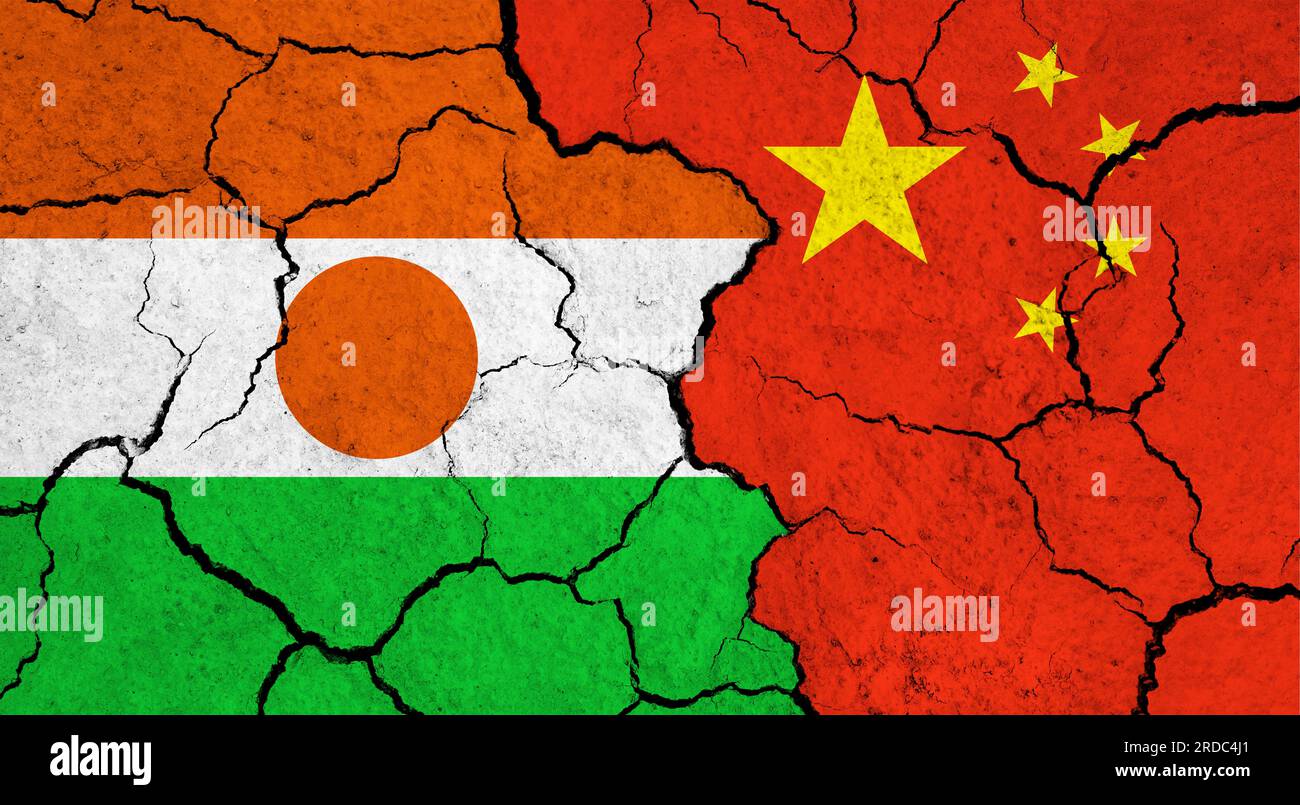 Flags of Niger and China on cracked surface - politics, relationship ...