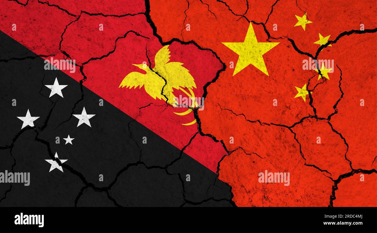 Flags of Papua New Guinea and China on cracked surface - politics ...