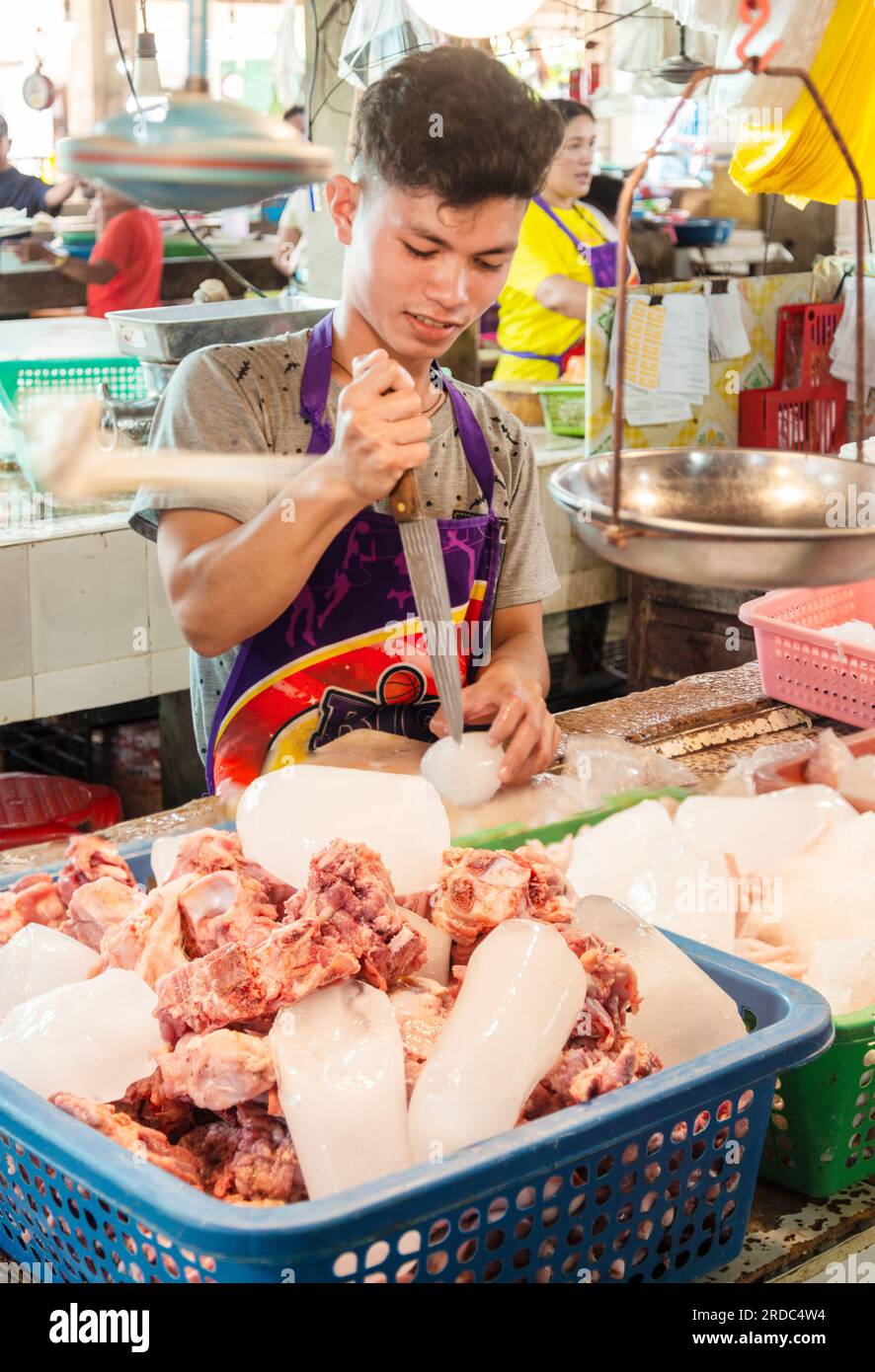 Cebu Island,The Philippines-January 27th 2023: Using the sharp pointed ...
