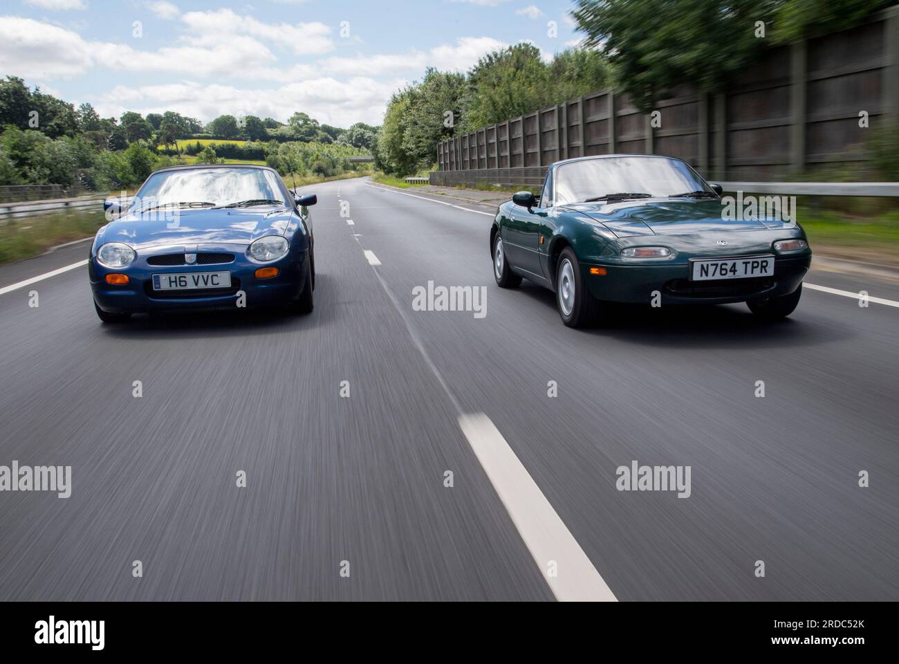 MGF and Mk1 Mazda MX5 open top sports cars Stock Photo - Alamy