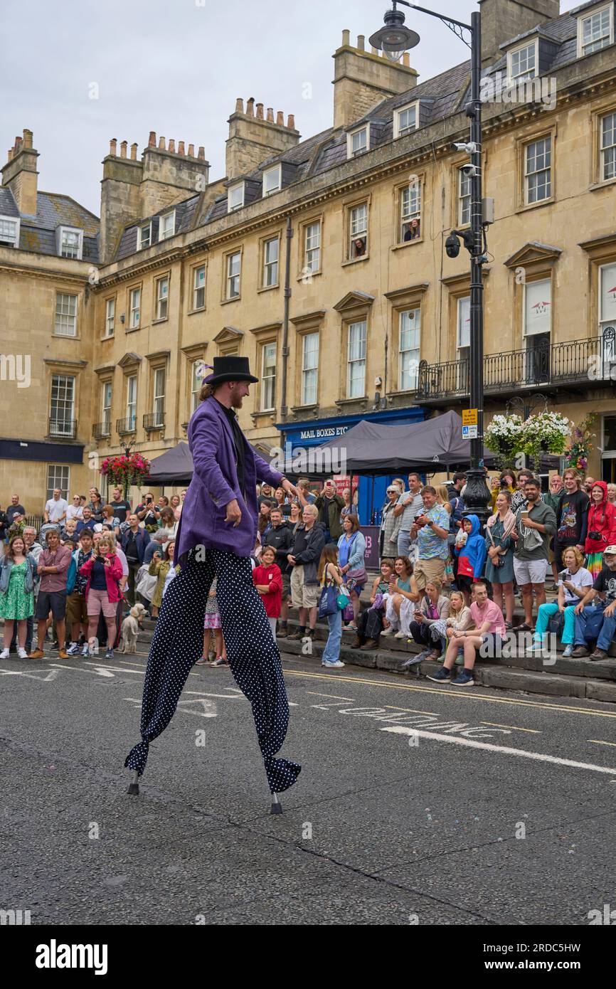 Dancers and musicians dressed in ornate costumes parade through the ...