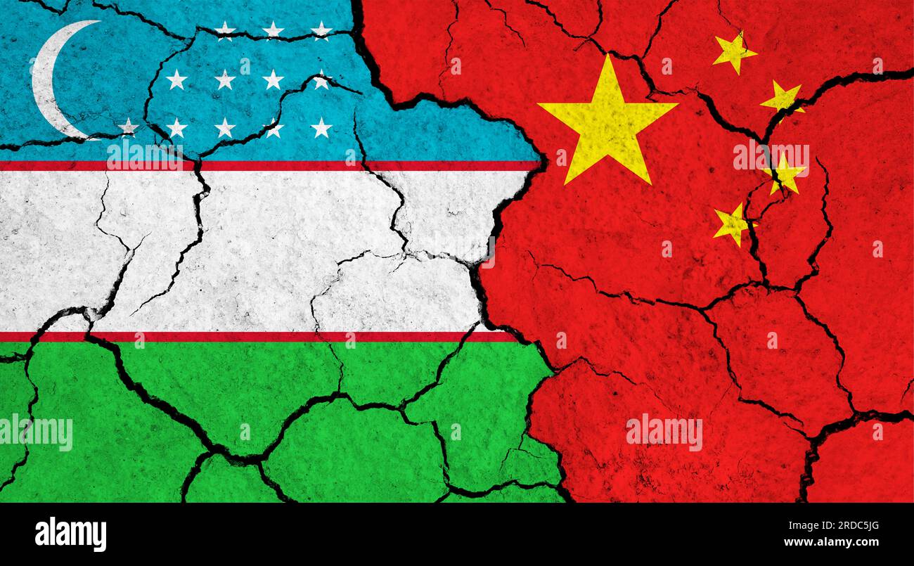 Flags of Uzbekistan and China on cracked surface - politics ...