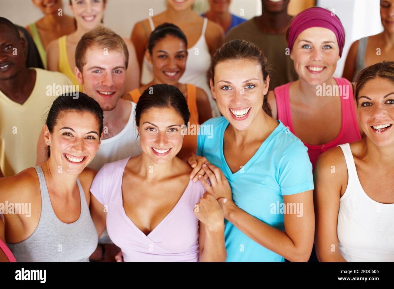 Yoga portraits. Portrait of a a group of yoga enthusiasts standing in a ...