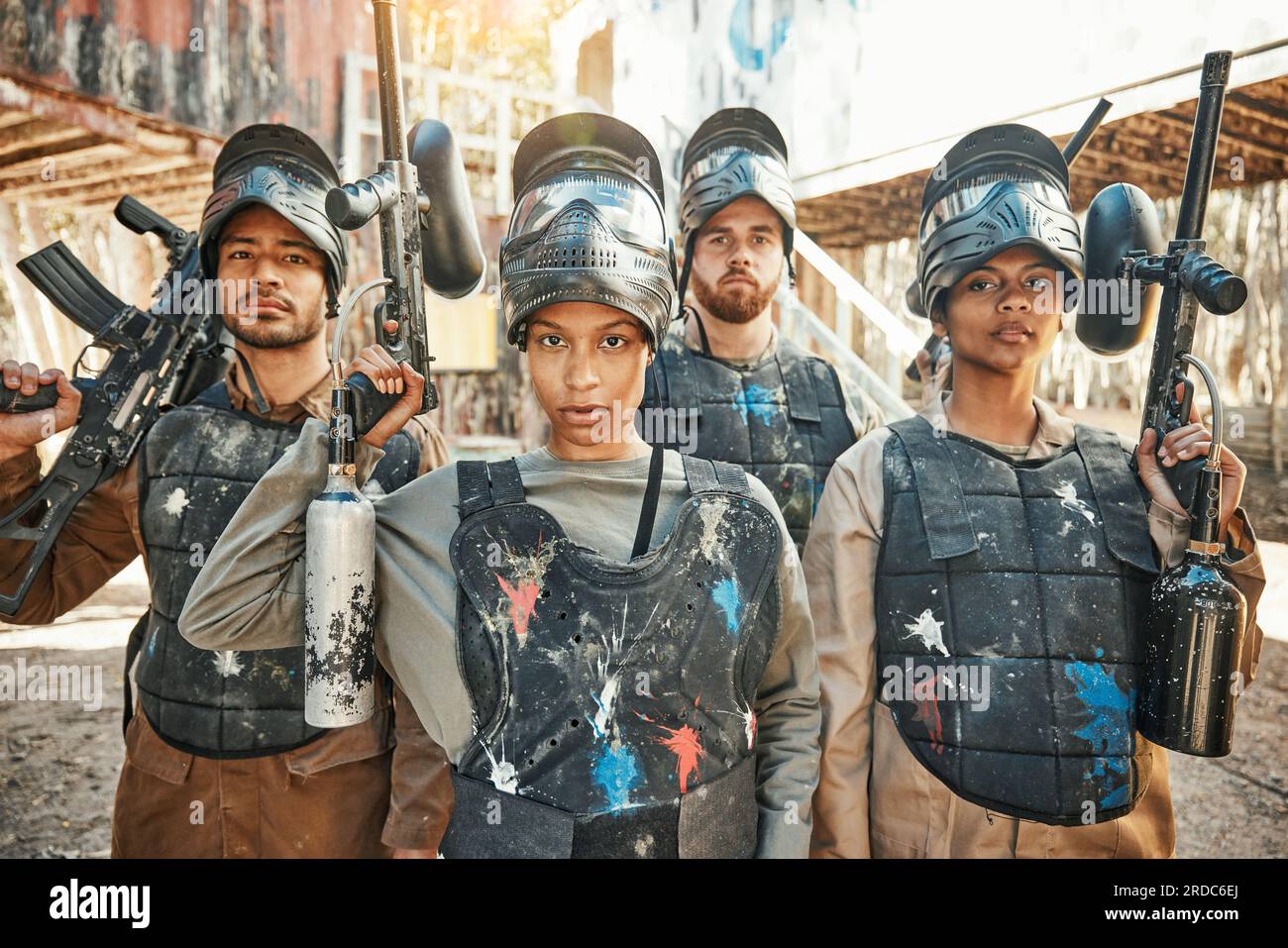 Paintball, serious and portrait of team or people ready for a battle ...