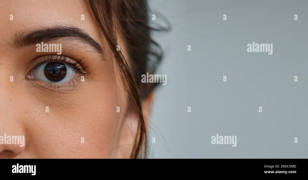 Woman, eye and zoom in portrait by space, mockup or health for vision ...