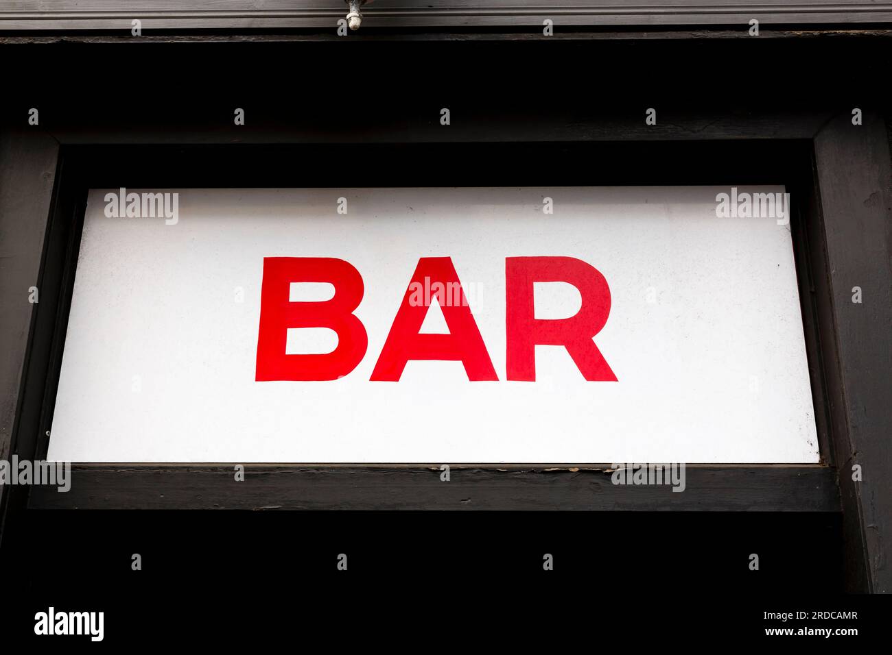A red Bar sign above the entrance to a pub Stock Photo - Alamy