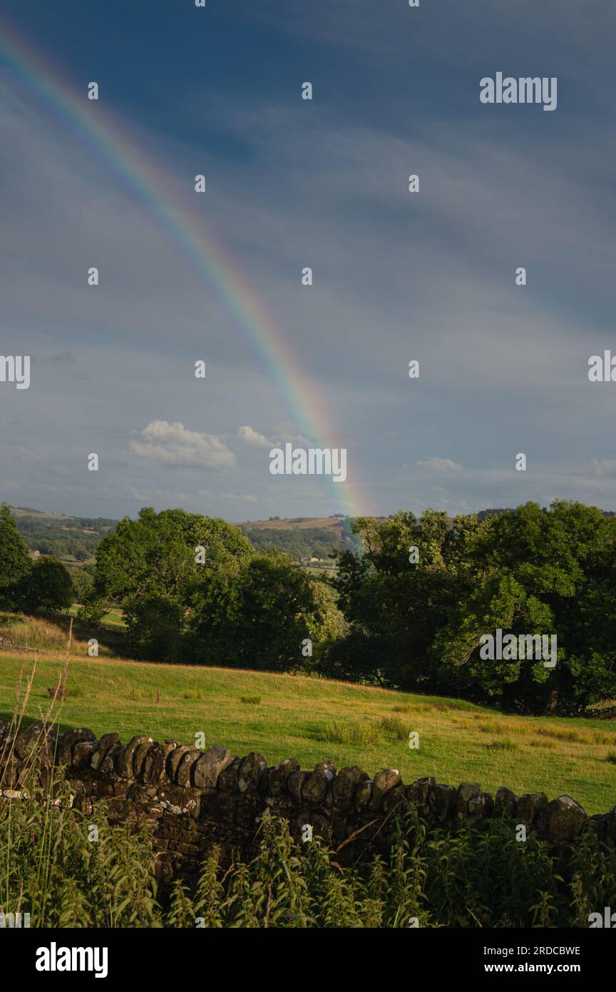 Rainbow over the North Pennines. Fields lit by transient light Stock ...
