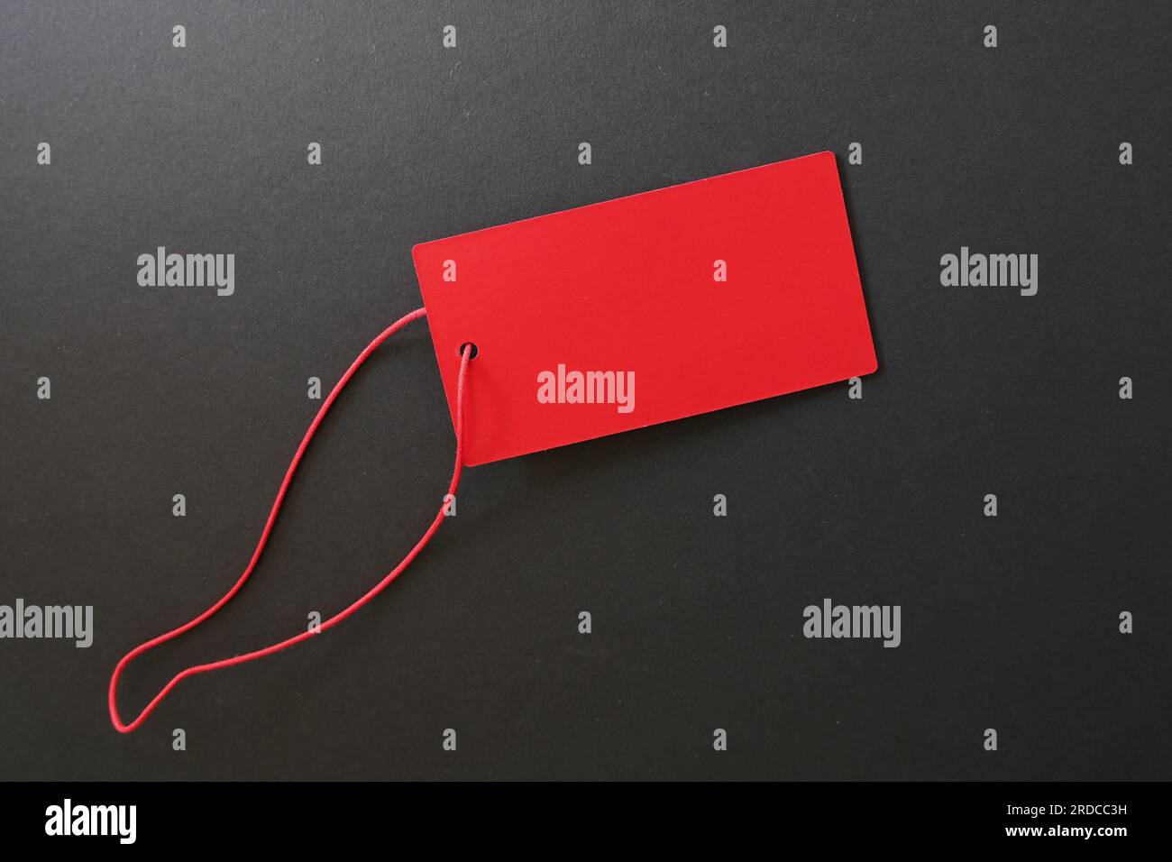 Red paper tag with string hi-res stock photography and images - Alamy