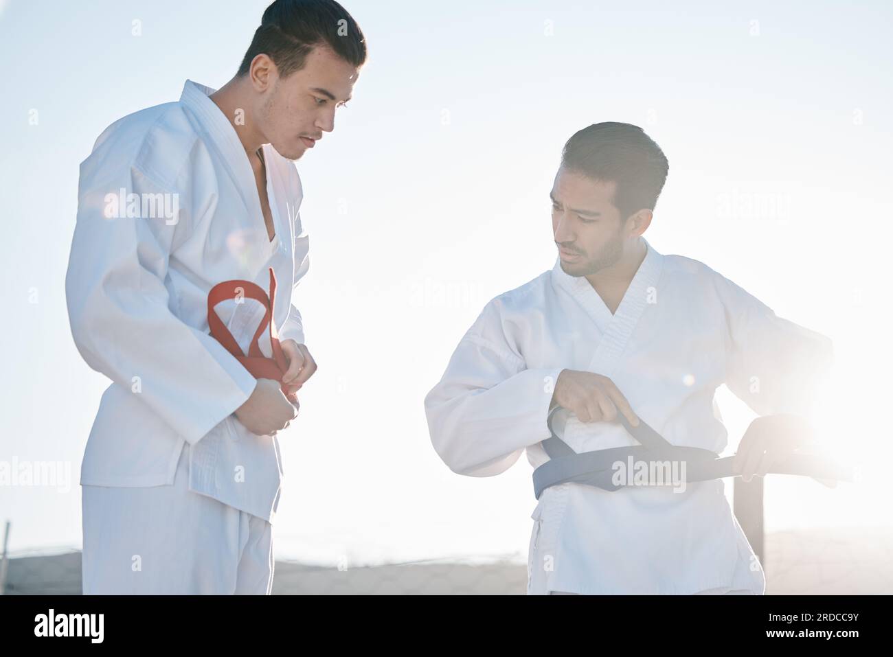 Karate men, teacher and tie belt with talk, questions and help for ...