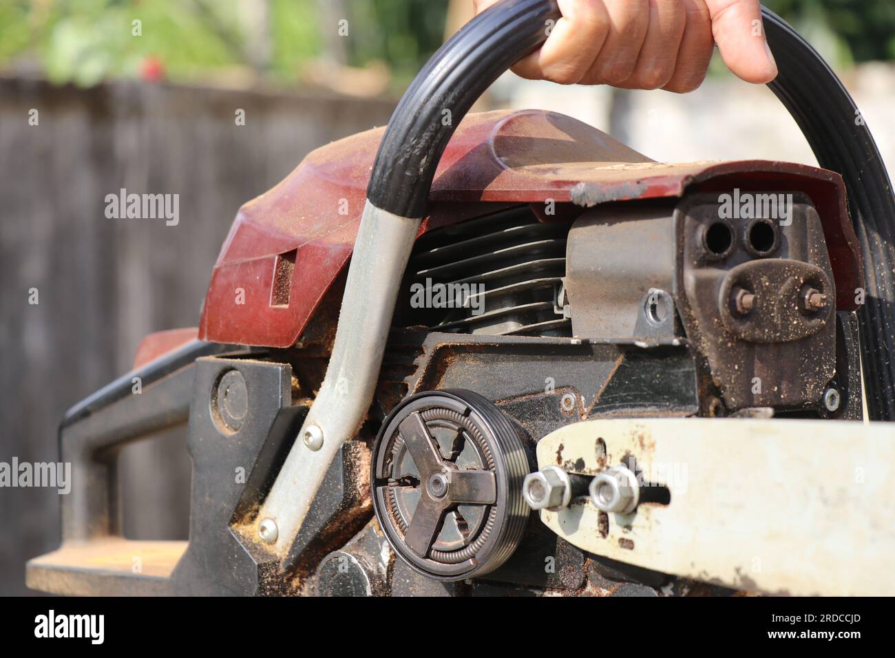 Old woodcutter engine with some missing parts of the machine held in ...