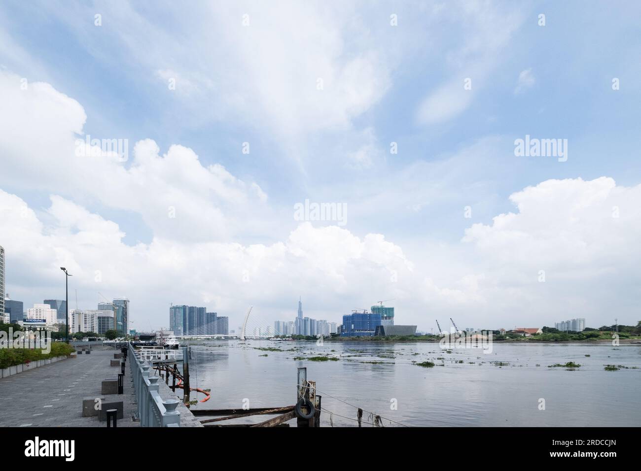 View across the Saigon River towards the Ba Son Bridge and financial ...