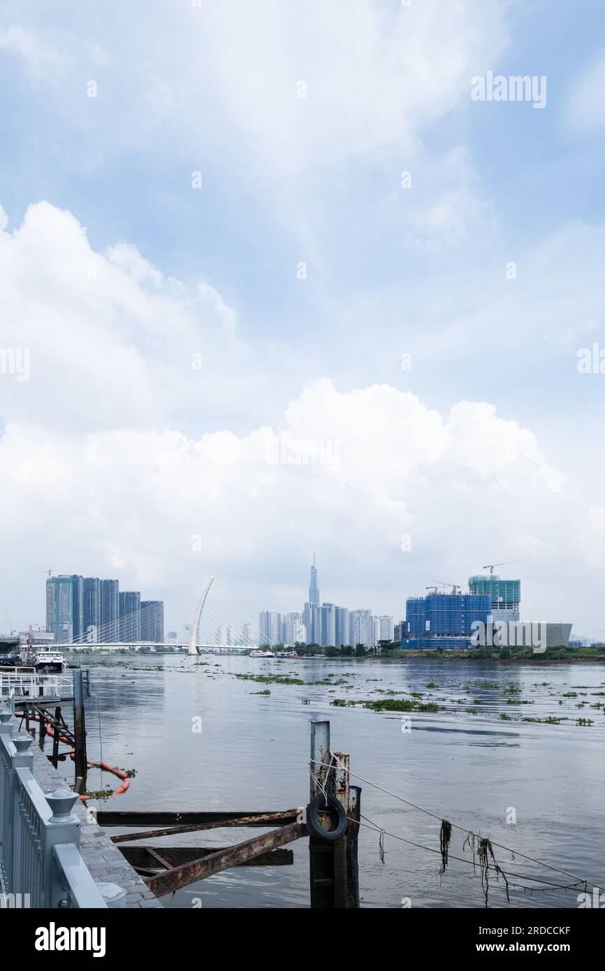 View across the Saigon River towards the Ba Son Bridge and financial ...