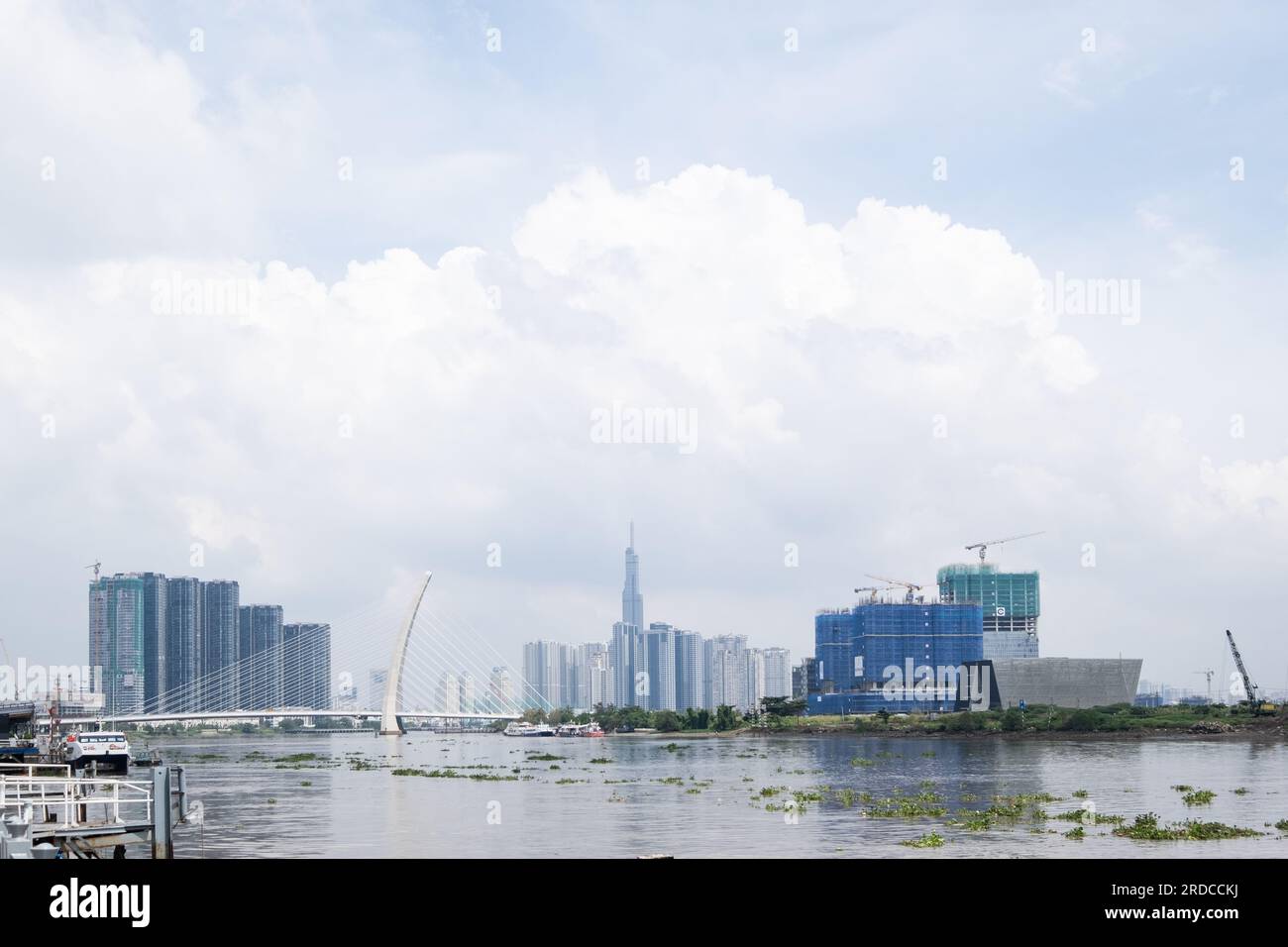View across the Saigon River towards the Ba Son Bridge and financial ...