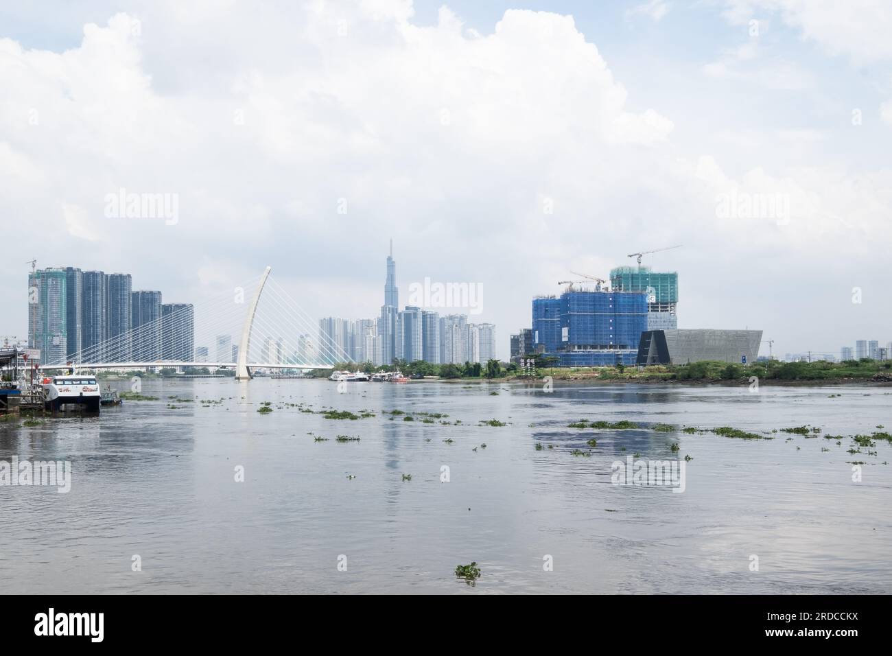 View across the Saigon River towards the Ba Son Bridge and financial ...