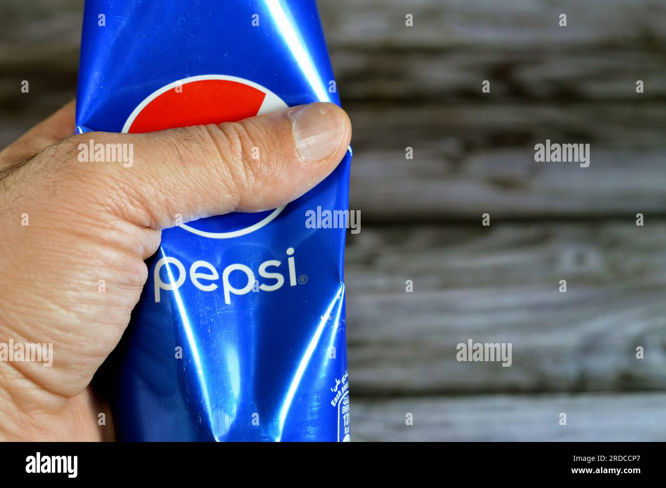 Cairo, Egypt, June 24 2023: Crushed Pepsi can, Cola flavor plastic ...