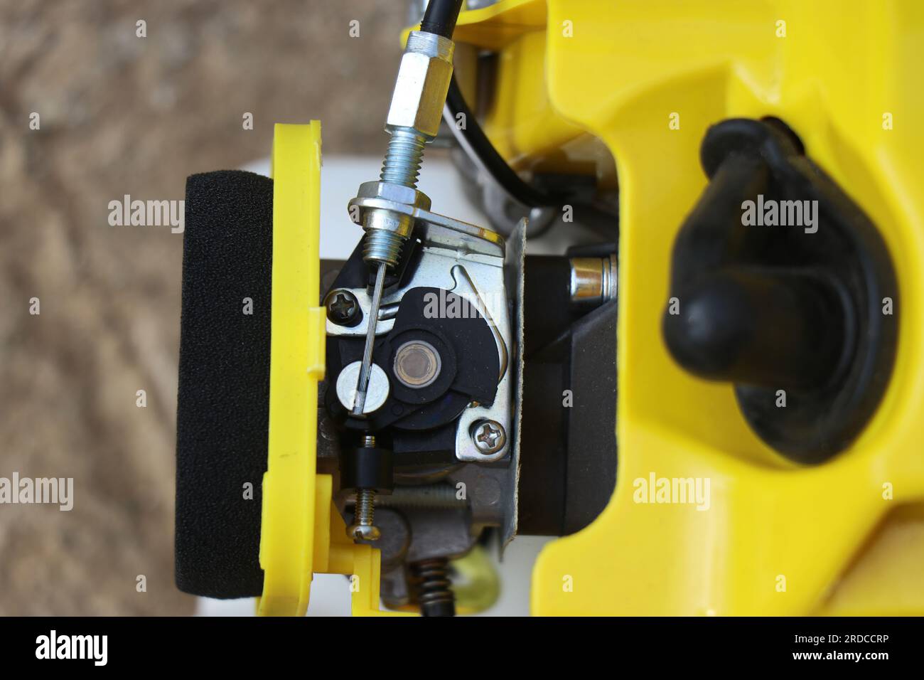 Fuel system elements of a gasoline trimmer. Carburetor and throttle ...