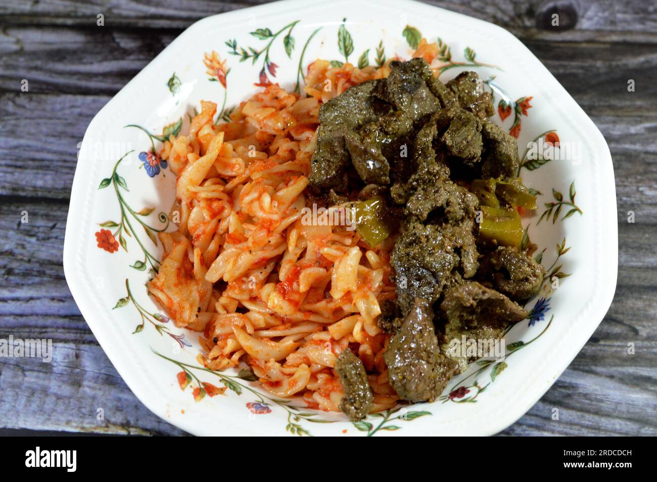 tasty appetizing classic pasta fusilli macaroni plate with tomato sauce ...